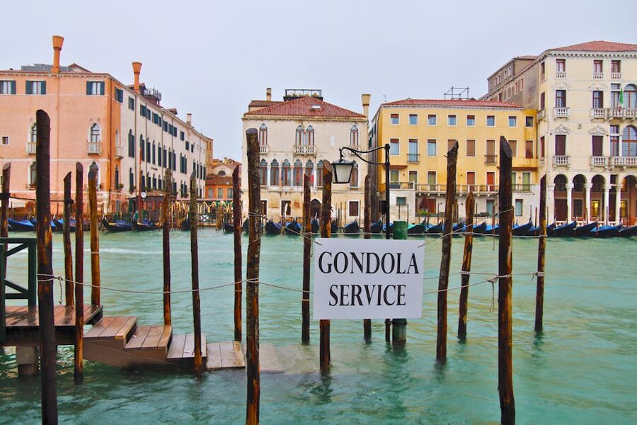 A gondola service sign on a Venice canal