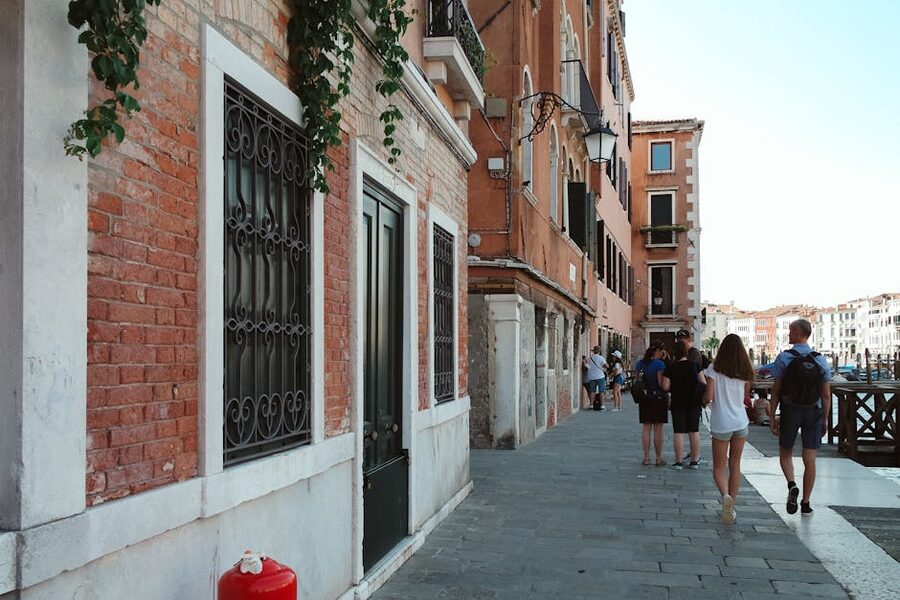 A summer day stroll along a Venice canal pathway