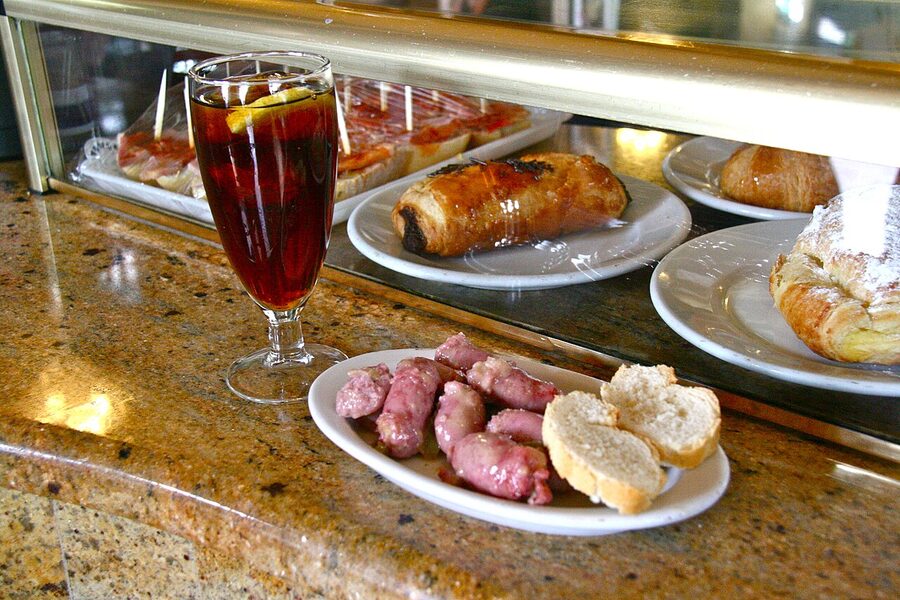 Vermouth with chicken sausage tapa Spanish bar ritual