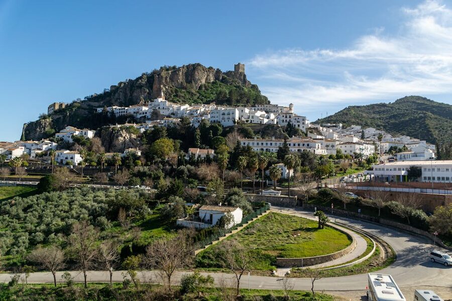 Aerial view of Zahara de la Sierra with castle and homes